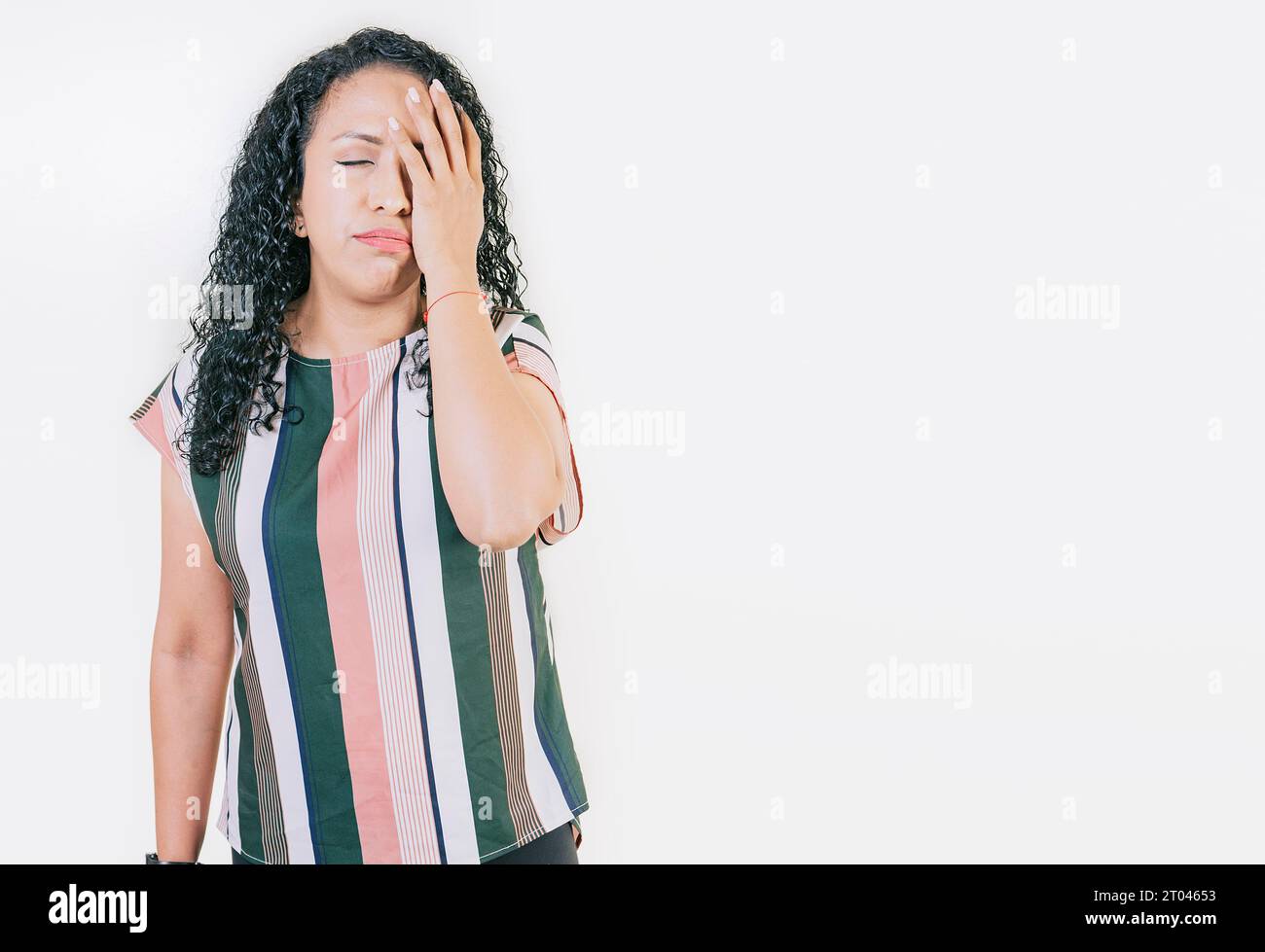 Stressed young woman holding her forehead. Stressed people with palm on ...
