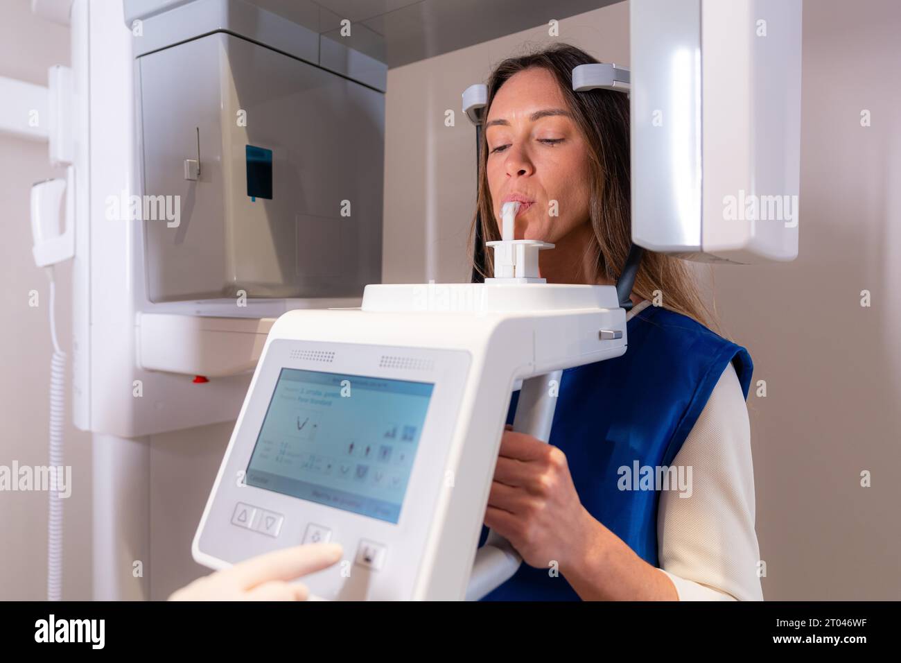 Profile photo of a woman at a radiography at professional dental clinic ...