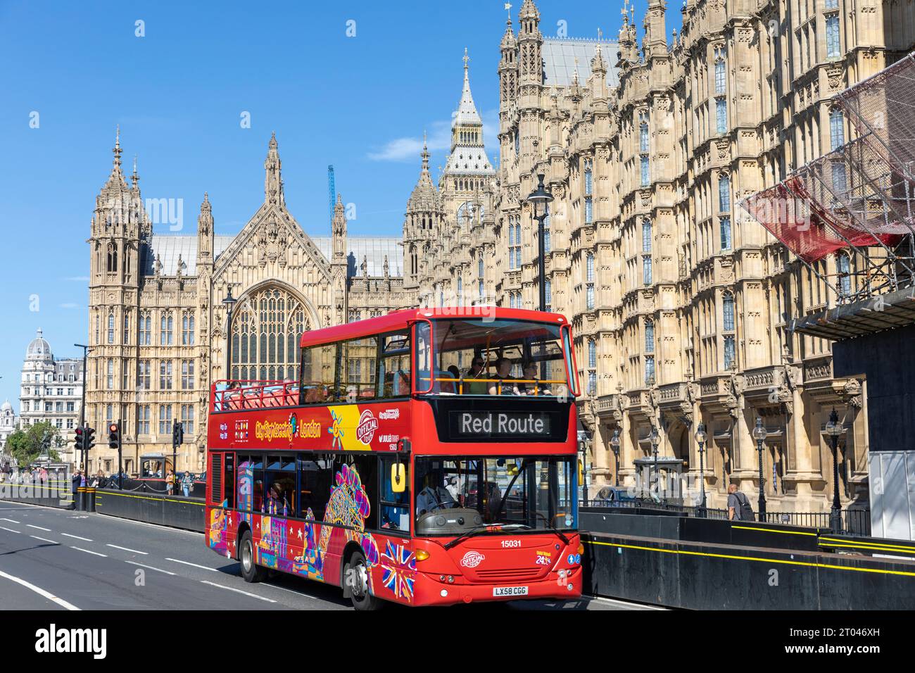 London red double decker sightseeing bus passes Houses of Parliament in ...