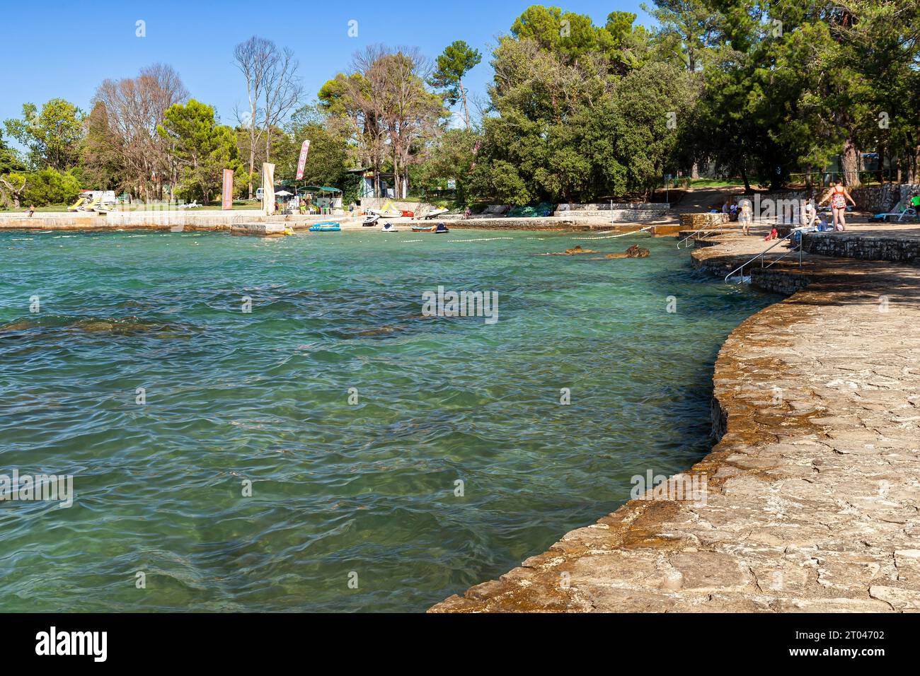 Beach on the stone coast of Spadici, Porec, Istria, Croatia Stock Photo ...