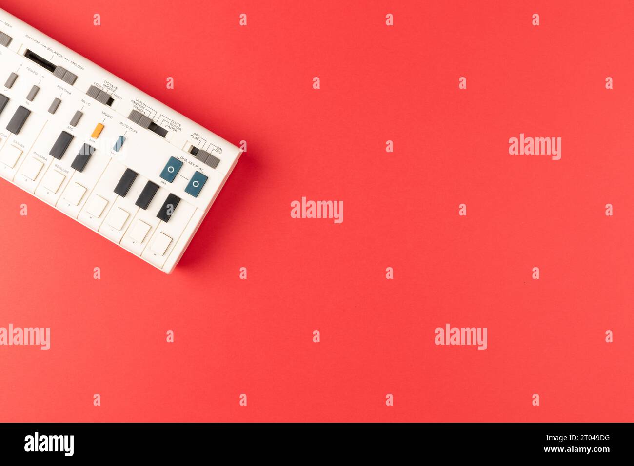 Vintage electronic keyboard synth piano on red background Stock Photo ...