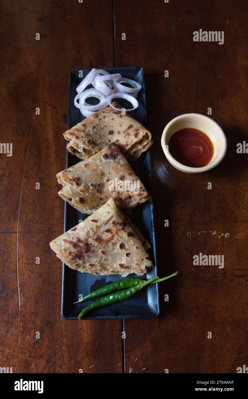 Top view of aloo paratha or potato stuffed flat bread on a tray Stock ...