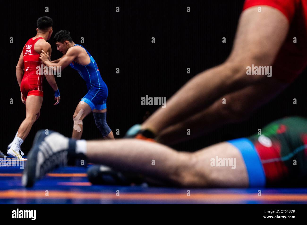 Japan's Endo Katsuaki and Kyrgyzstan's Beishekeev Razzak compete during ...