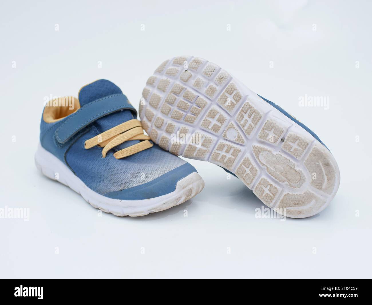used dirty boy shoes isolated on white Stock Photo - Alamy