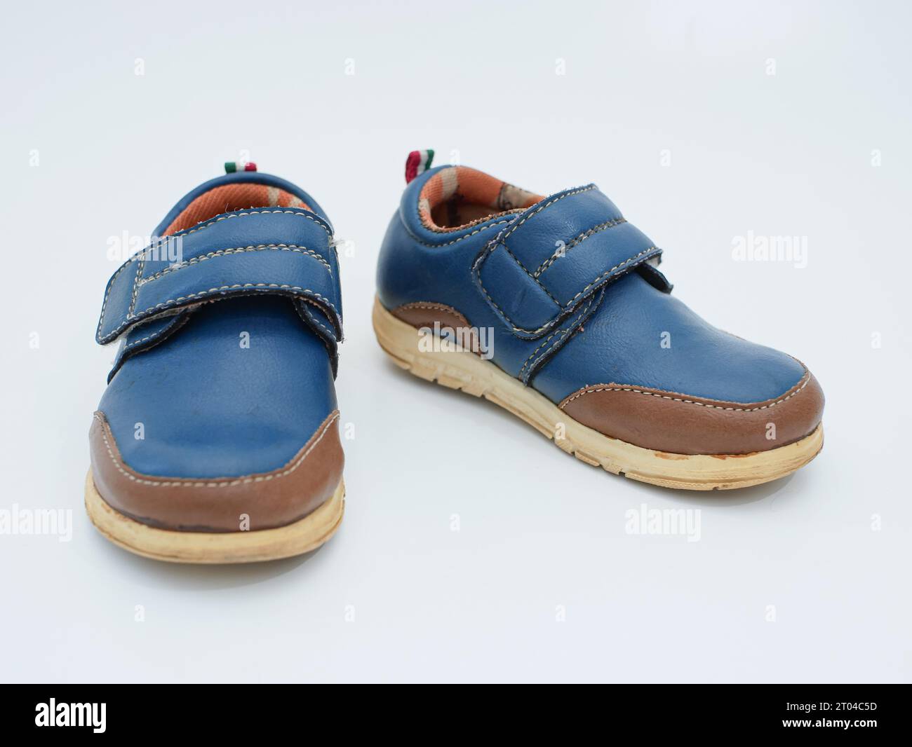 used dirty boy shoes isolated on white Stock Photo - Alamy