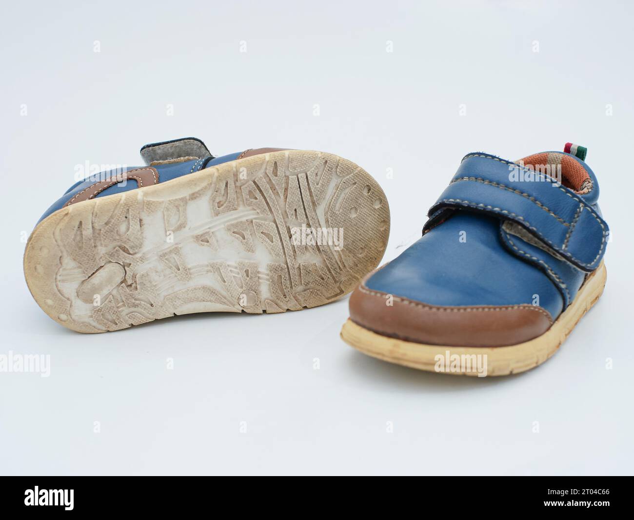 used dirty boy shoes isolated on white Stock Photo - Alamy