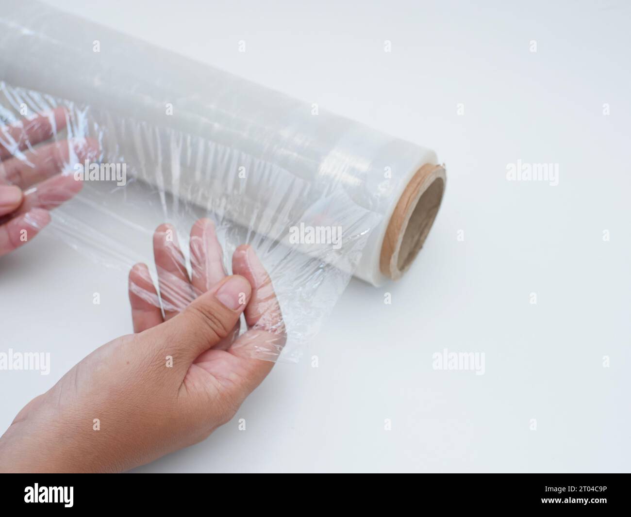 Roll of transparent plastic wrapping on white background Stock Photo ...