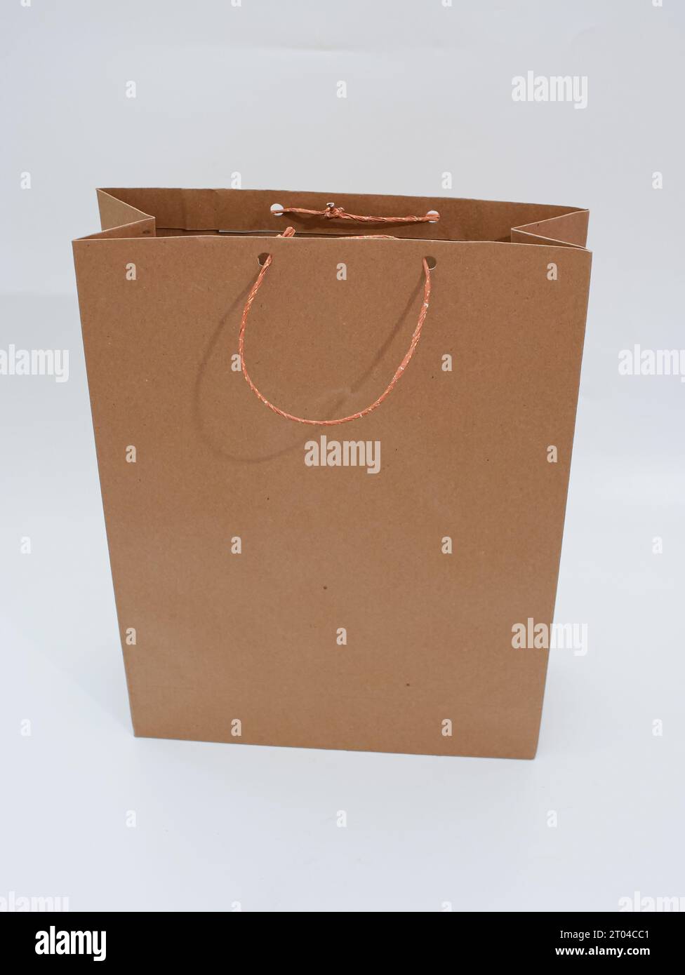 paper bag package isolated on white background Stock Photo - Alamy