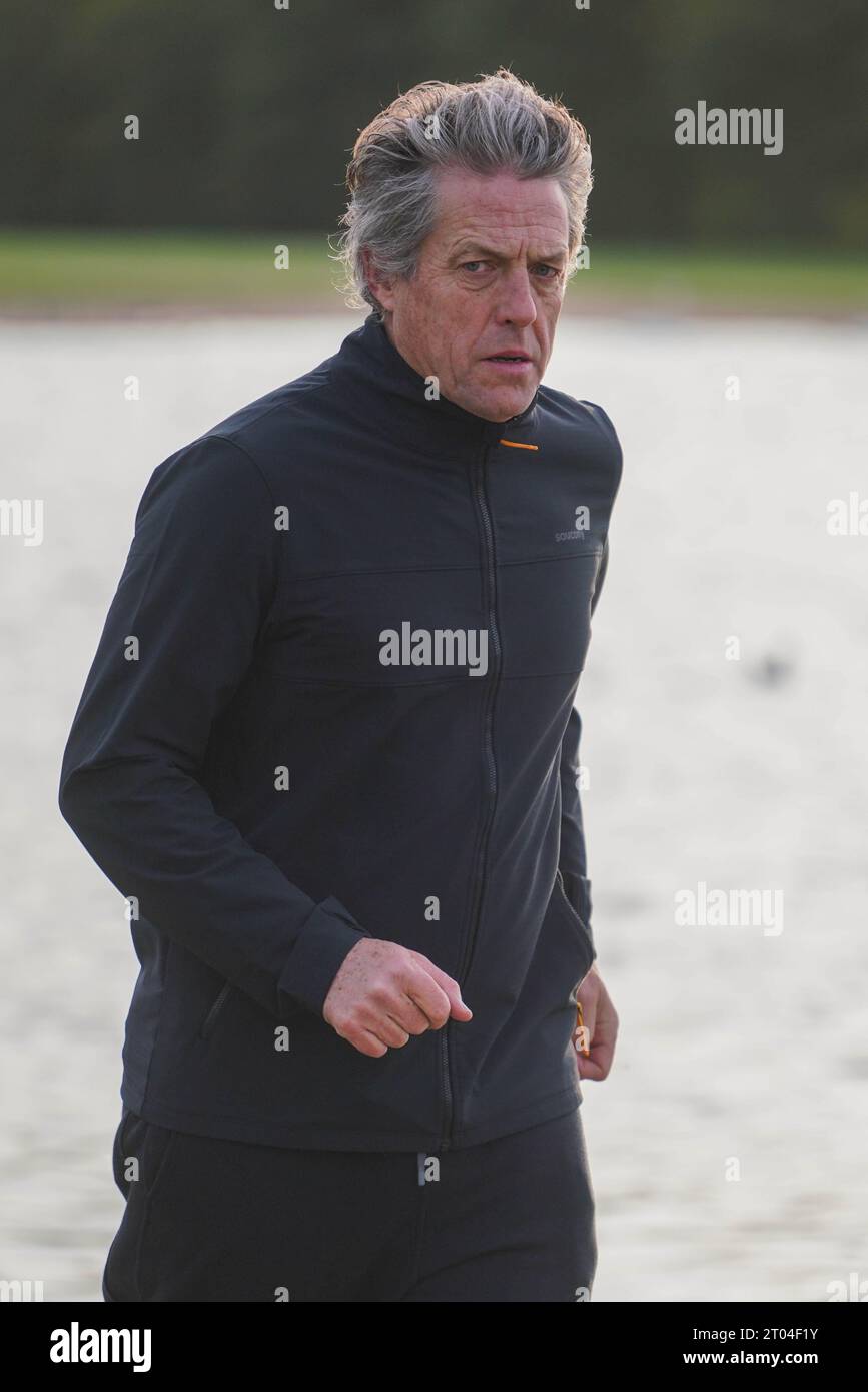 London UK. 4 October 2023. English actor Hugh Grant seen jogging in the ...