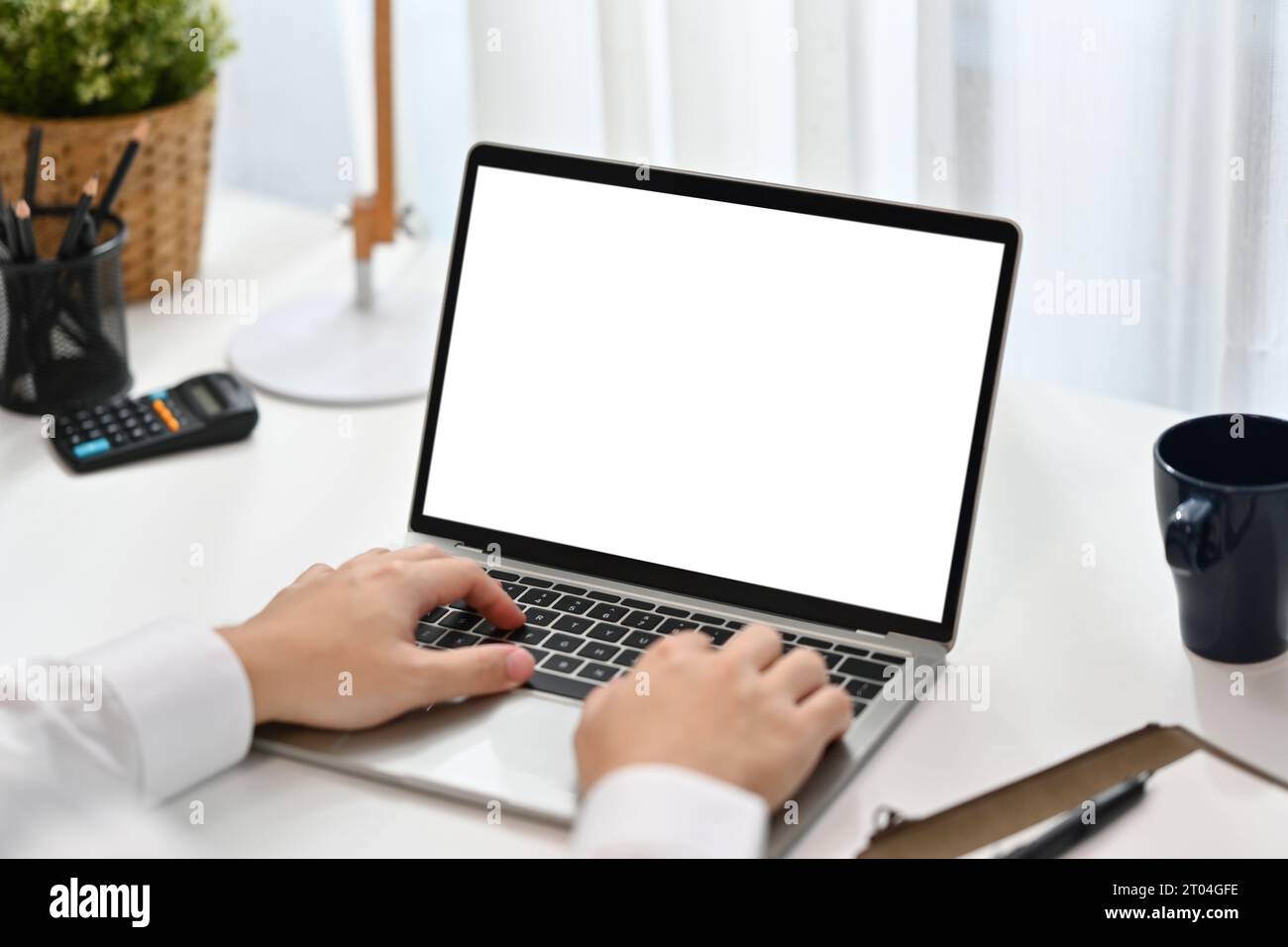Closeup view unrecognizable businessman typing on laptop. Blank screen ...