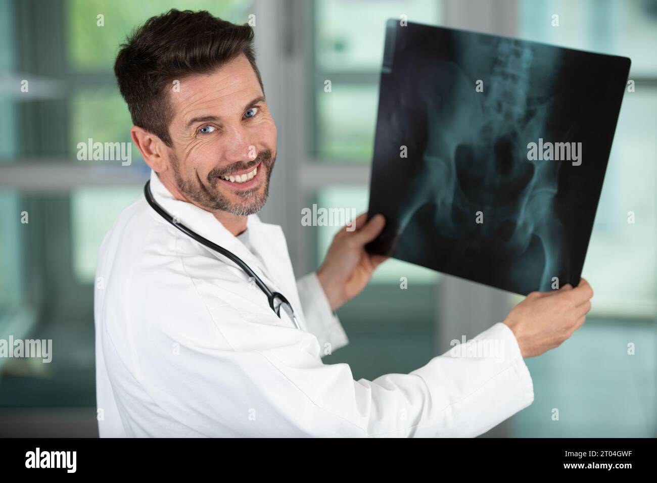 mature male radiologist holding x-ray Stock Photo - Alamy