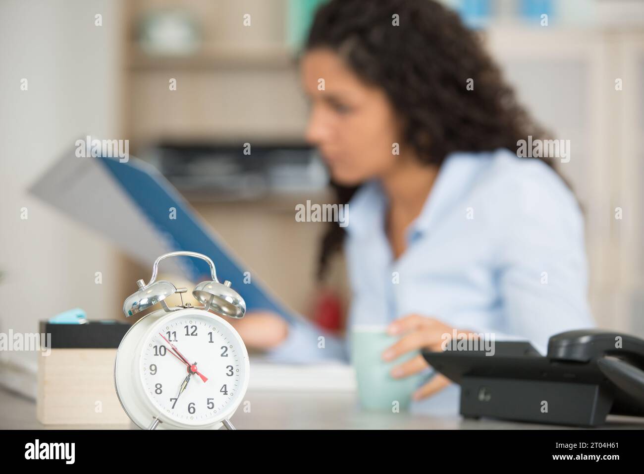 Female secretary reading documents hi-res stock photography and images ...
