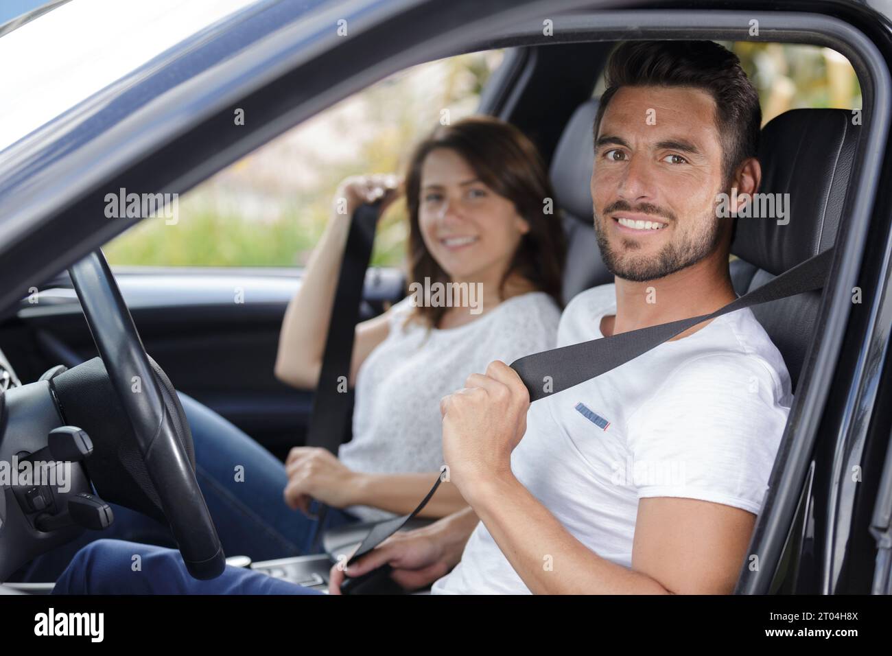 beautiful happy love couple inside a car Stock Photo - Alamy