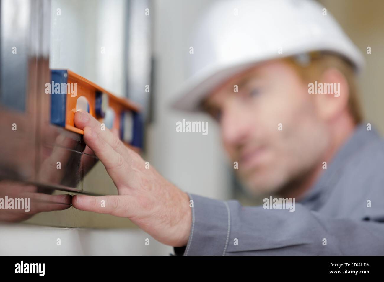 builders level on window seal Stock Photo - Alamy