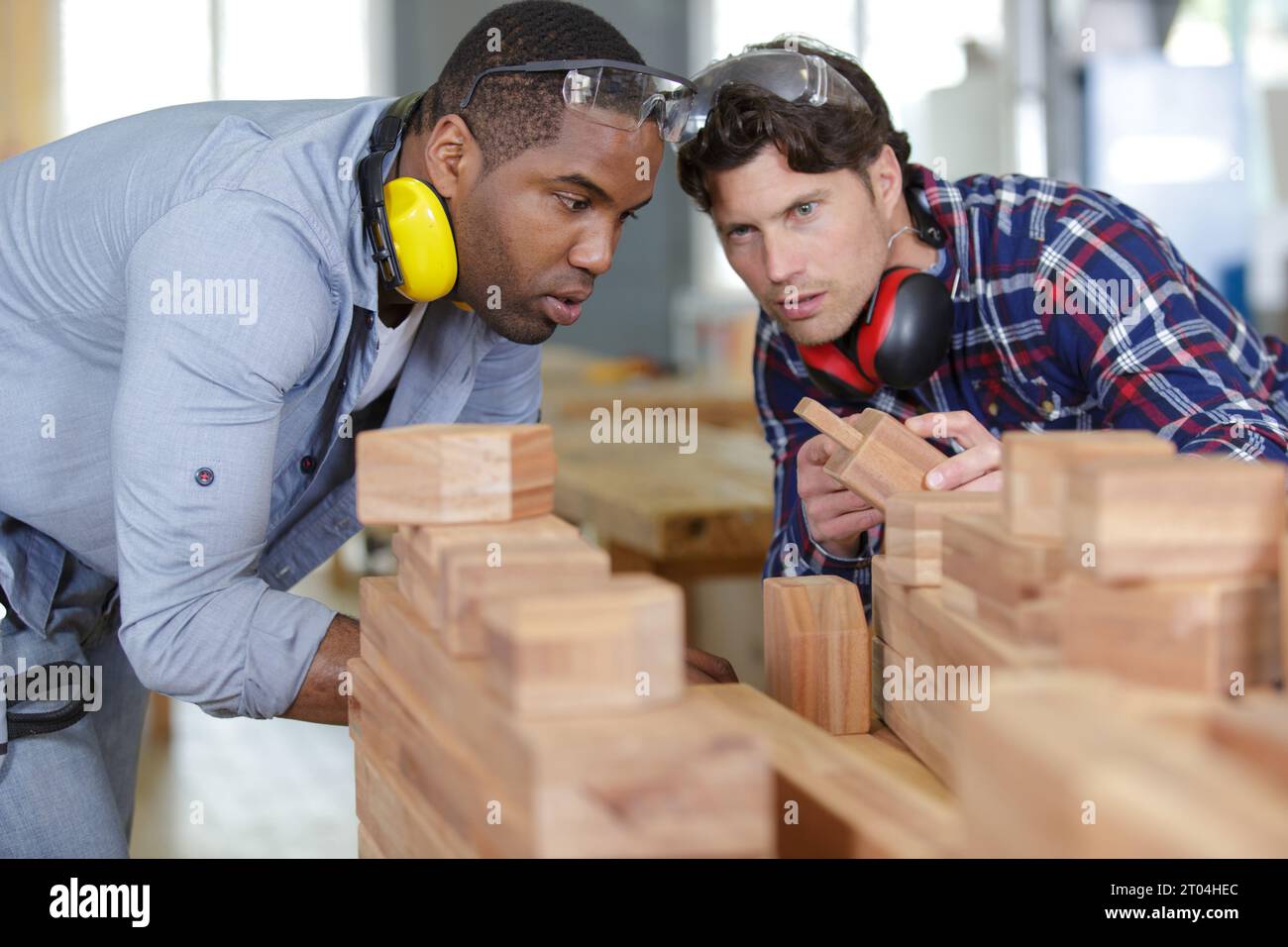 two male carpenters in woodworking workshop Stock Photo - Alamy