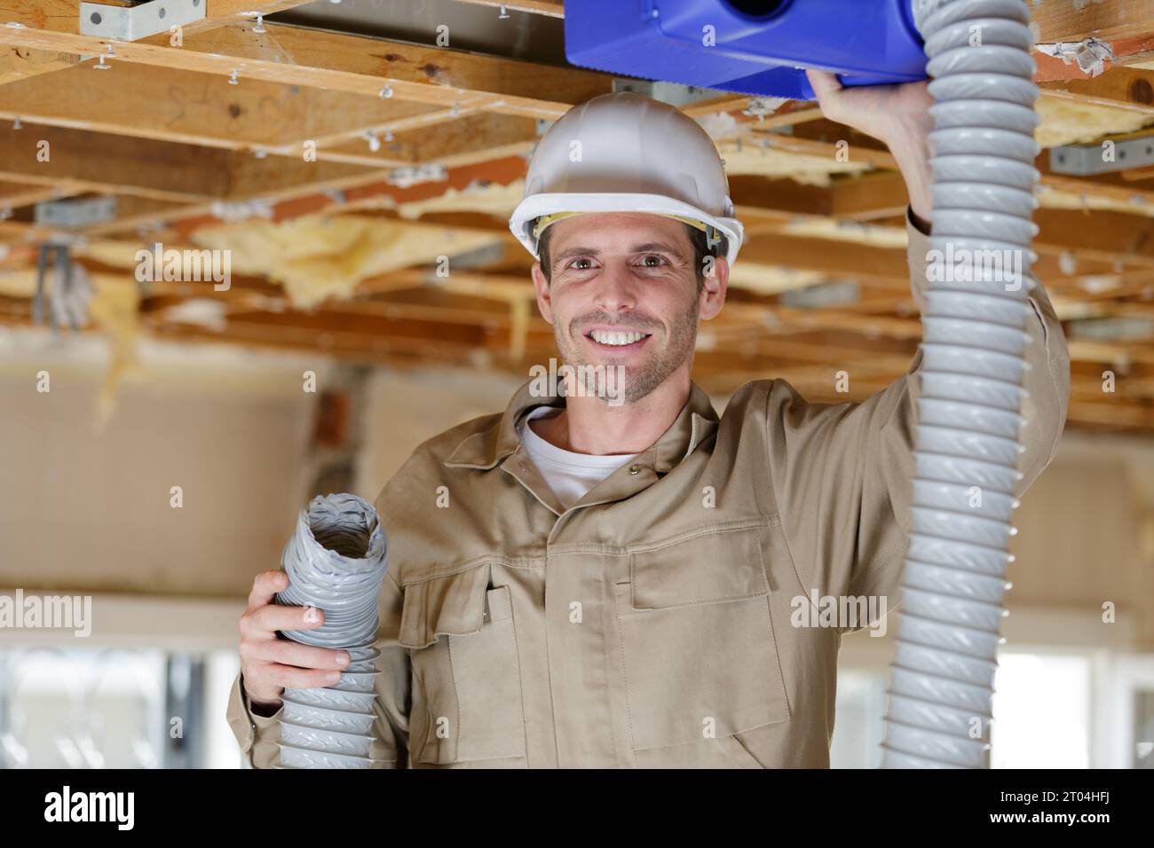 Plasterer spreading plaster ceiling hi-res stock photography and images ...