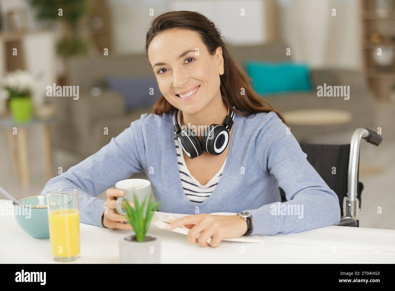 beautiful disabled woman in wheelchair at home Stock Photo - Alamy