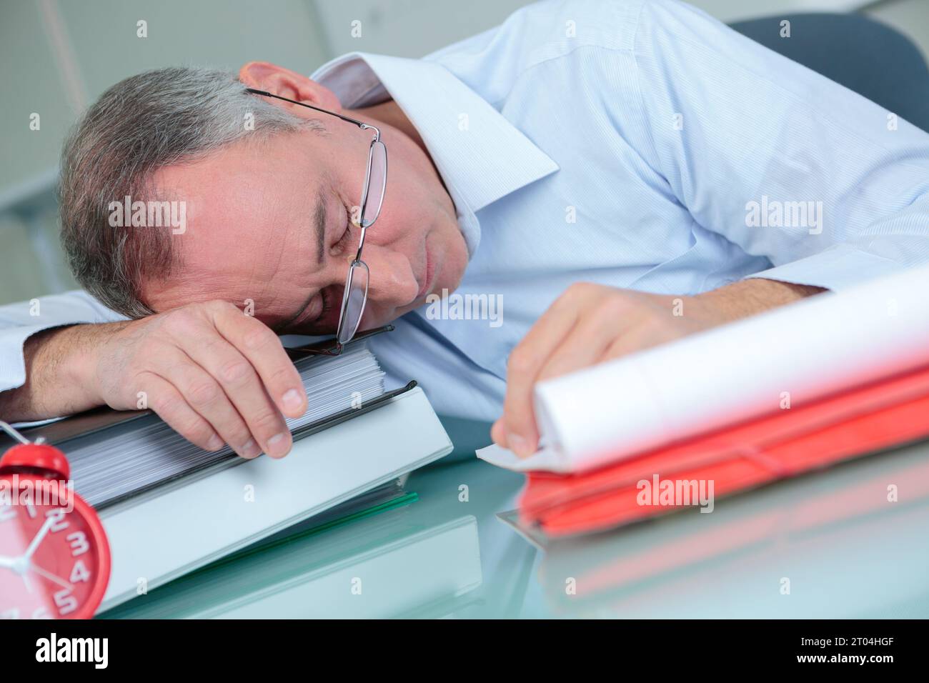 senior man asleep at office desk Stock Photo - Alamy