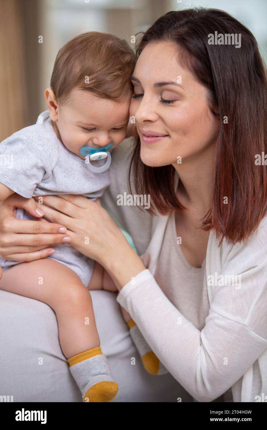 blissful mother cuddling her child Stock Photo - Alamy