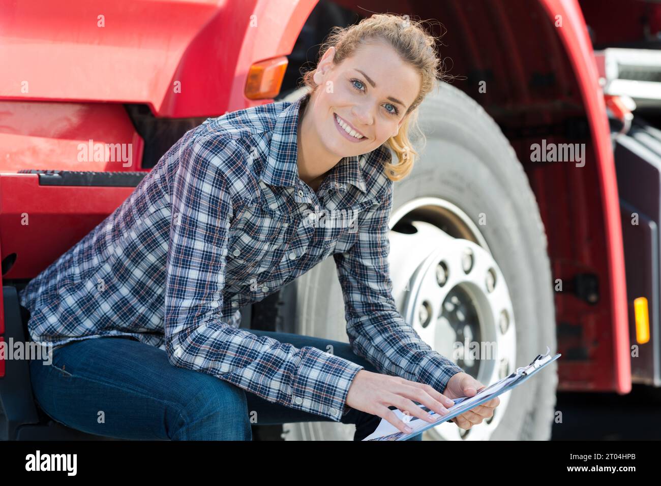 young female driver next to a modern truck Stock Photo - Alamy