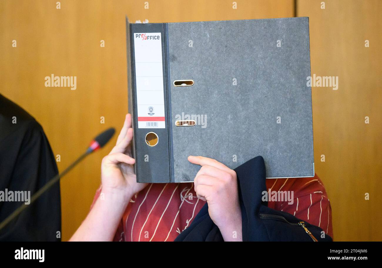 Hildesheim, Germany. 04th Oct, 2023. One of the three defendants sits ...