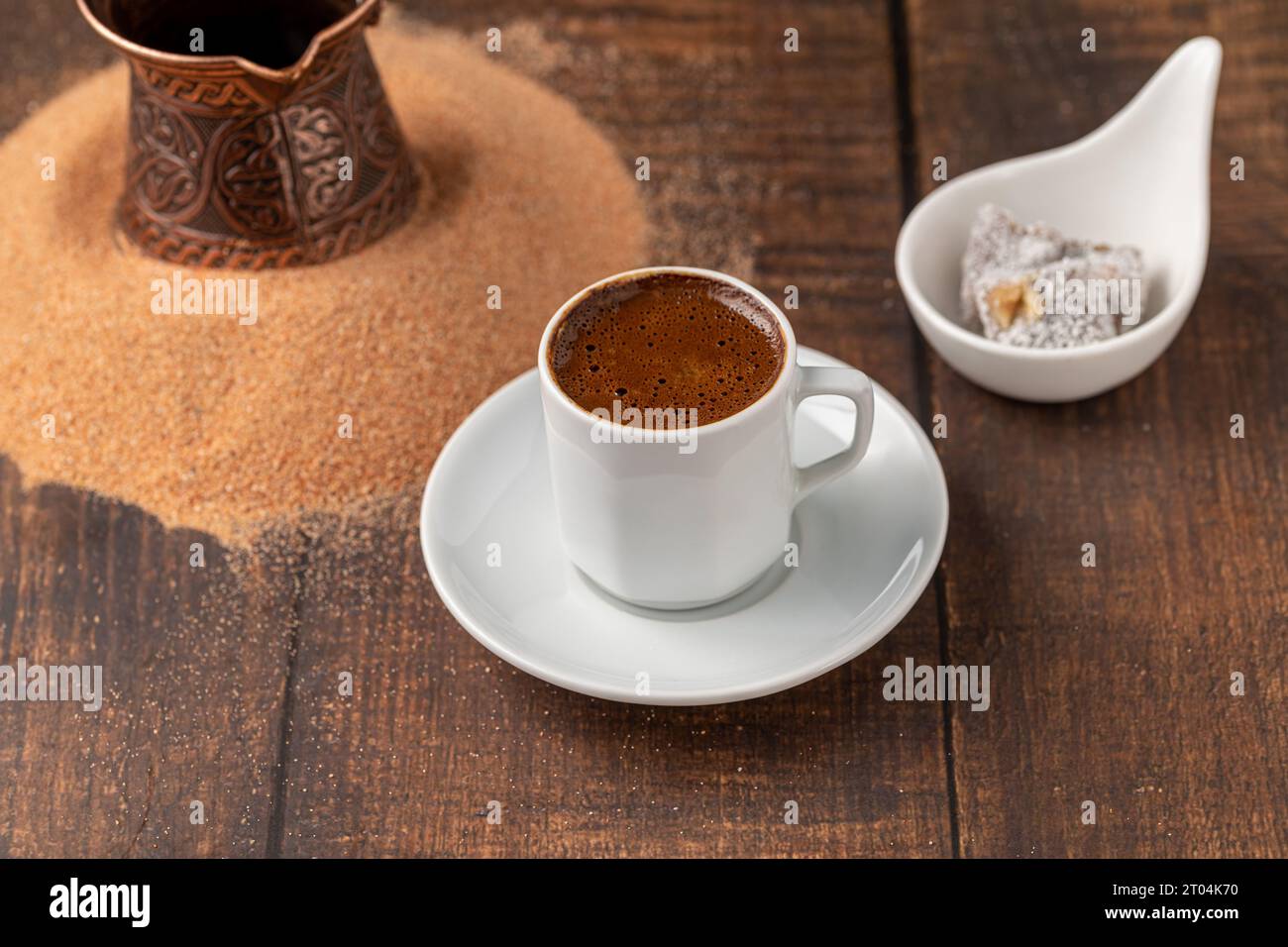 Turkish coffee cooked in hot sand with Turkish delight in a classic ...