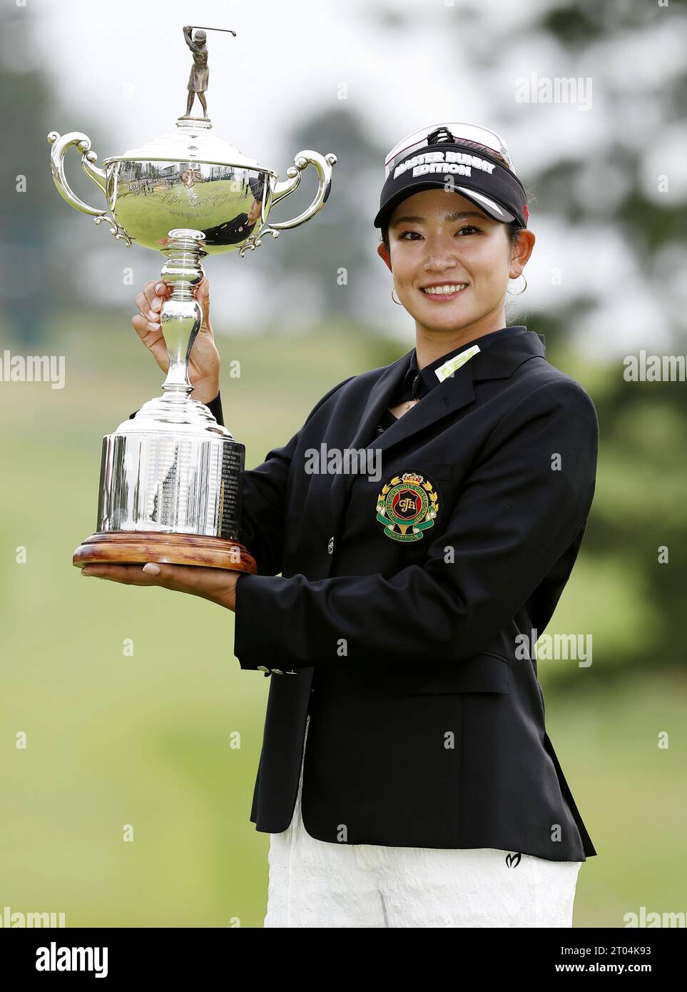 Erika Hara of Japan celebrates with the trophy after her victory at the ...
