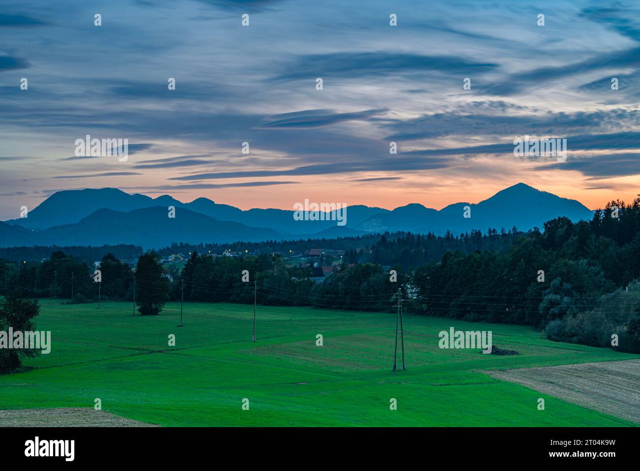Green meadow at a sunset Stock Photo - Alamy