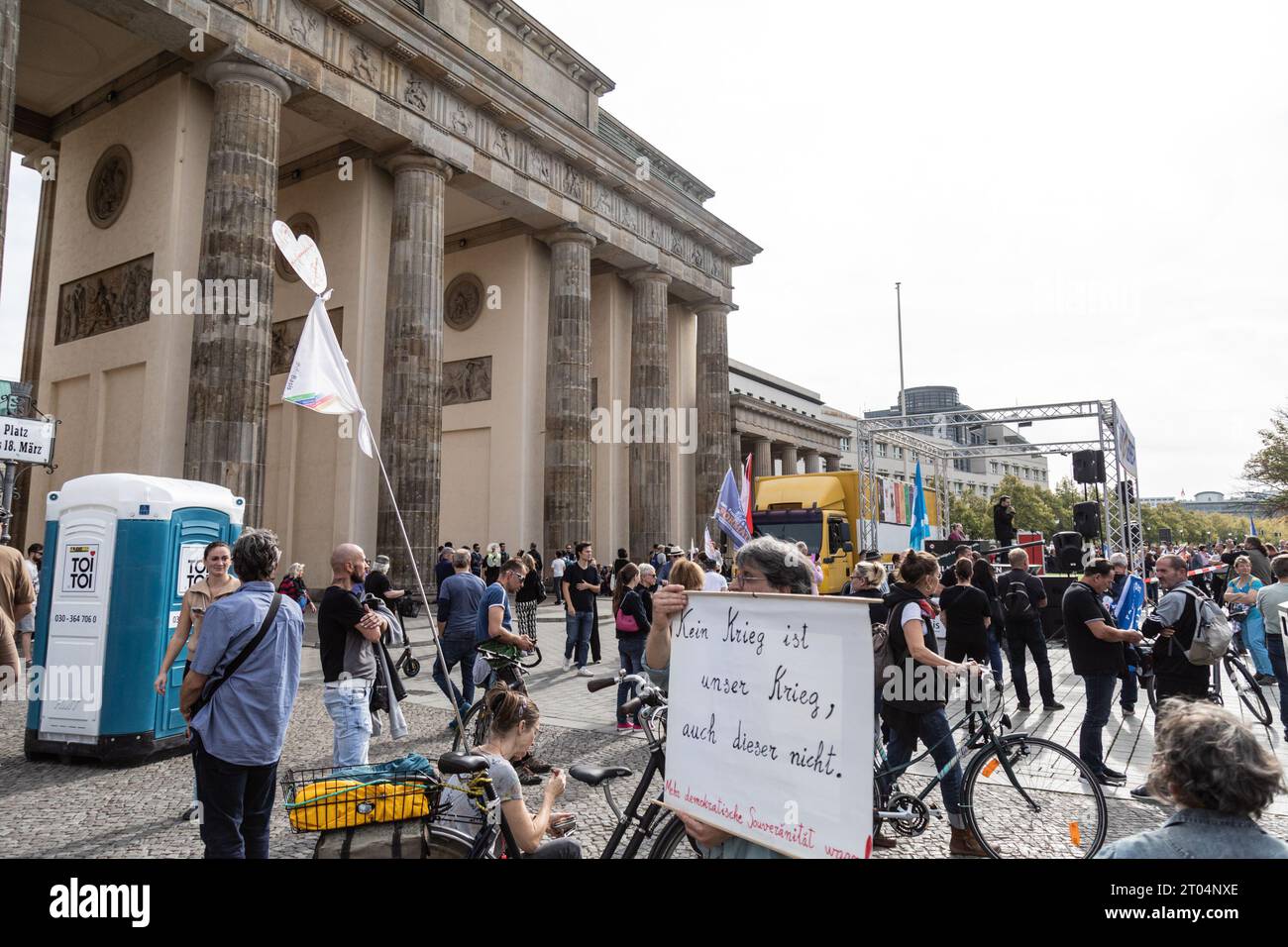 Berlin, Germany. 03rd Oct, 2023. A protestor holds up a placard during ...