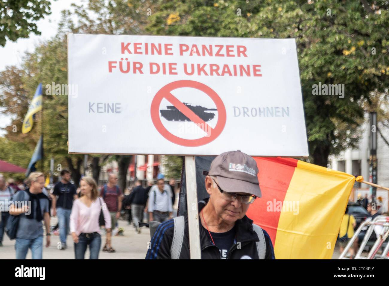 Berlin, Germany. 03rd Oct, 2023. A demonstrator holds a placard in ...