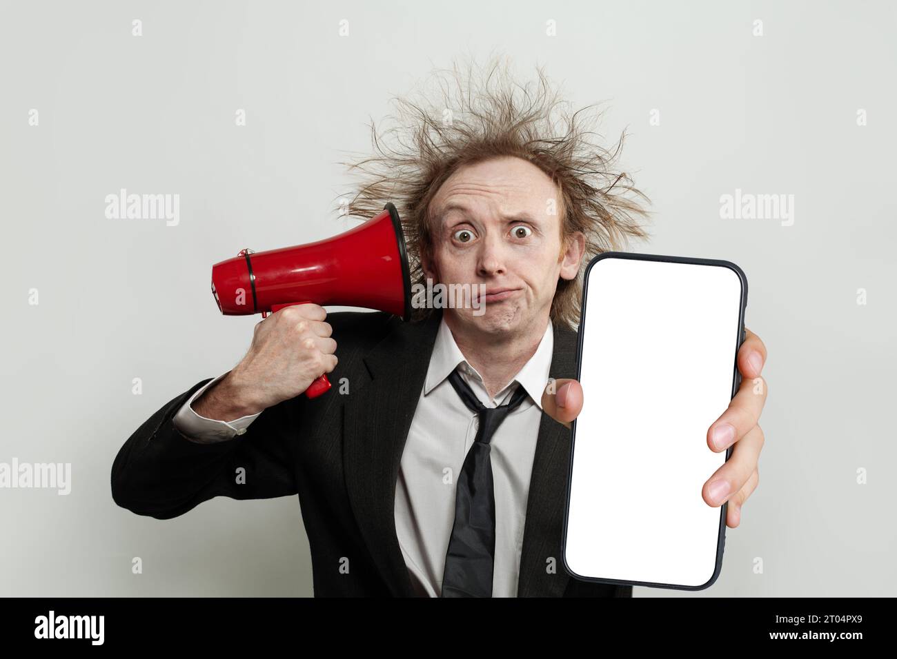 Shocked frustrated stressed businessman holding red loudspeaker and ...