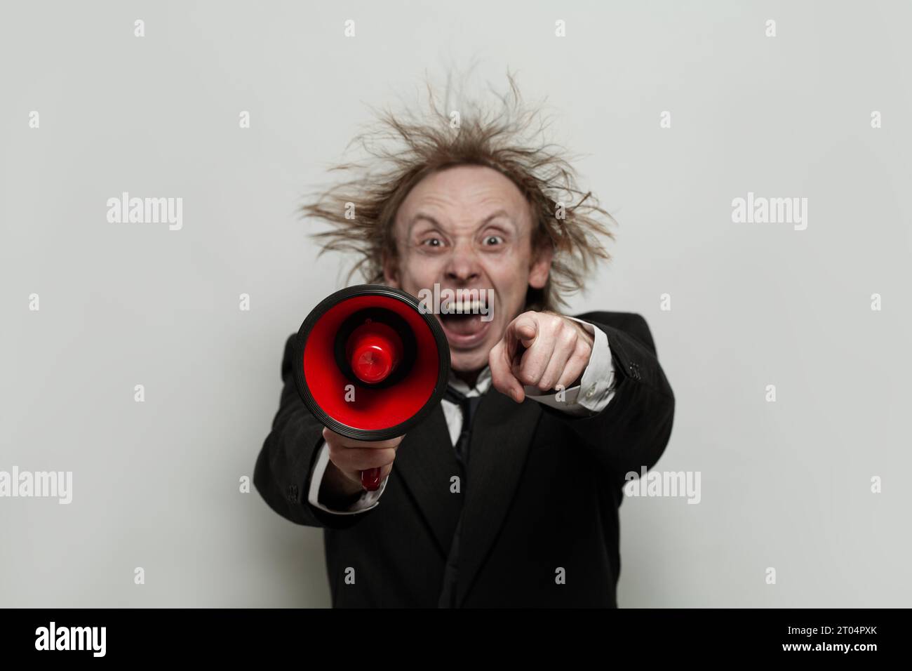 Angry boss businessman with red loudspeaker shouting and pointing ...