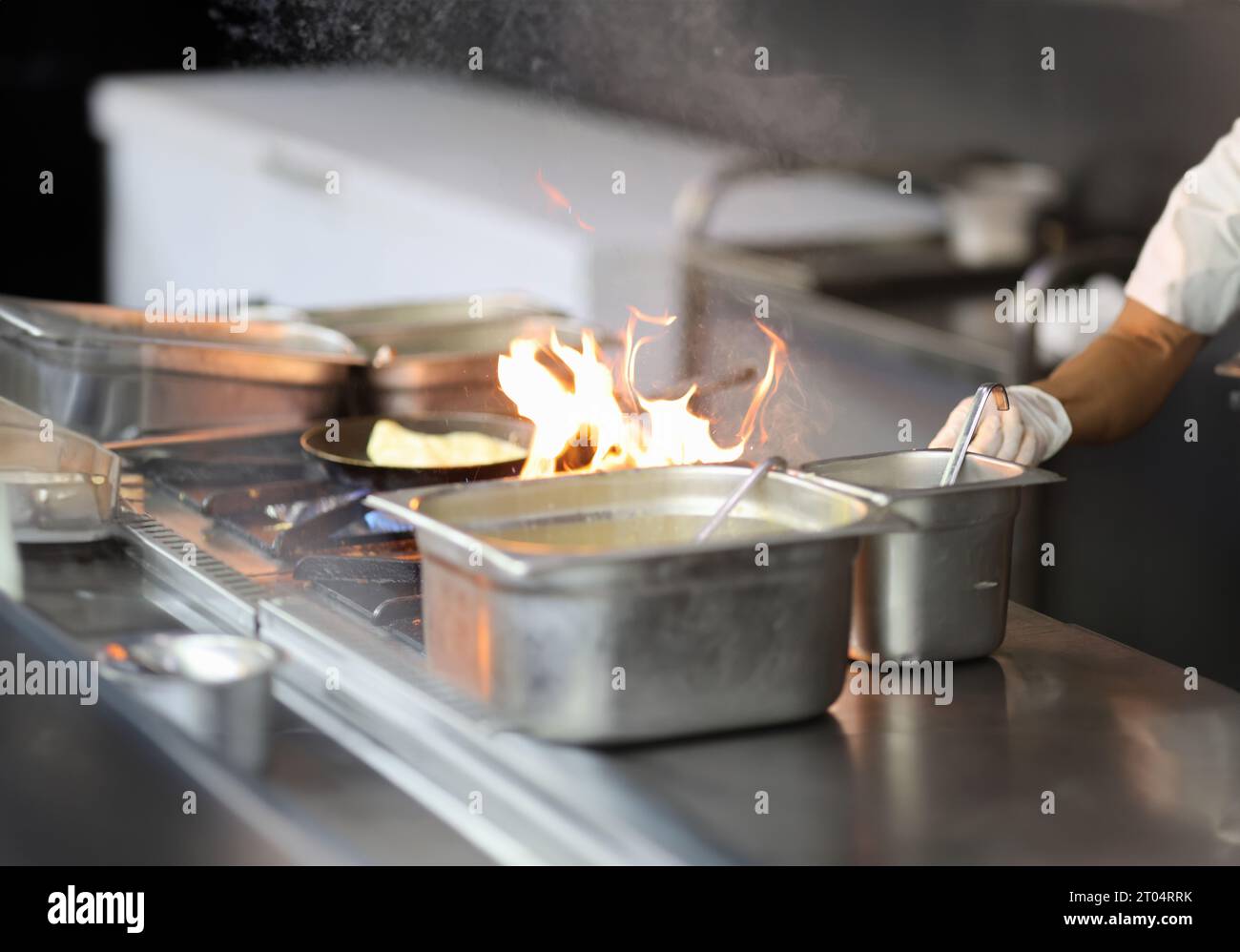 Cooking in the kitchen in restaurant on fire Stock Photo - Alamy