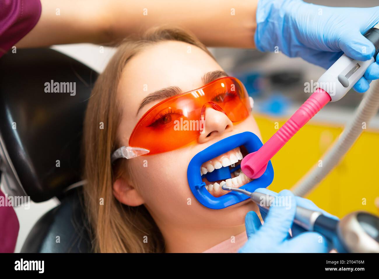 Patient in protective glasses from UV light with tubule for liquid ...