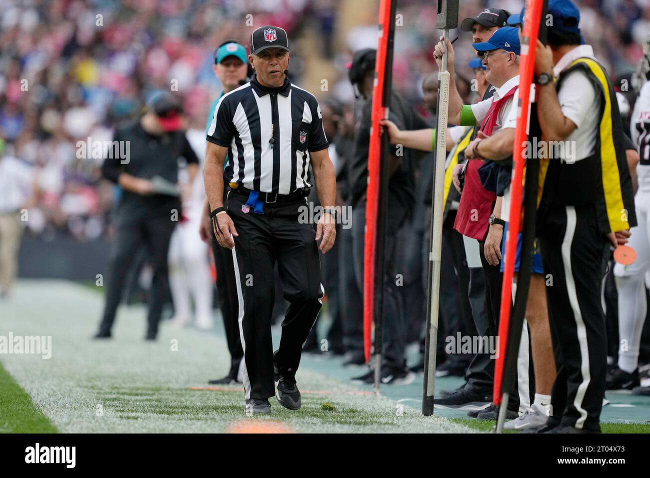 Down judge Jim Mello (48) walks on the sideline during an NFL football ...