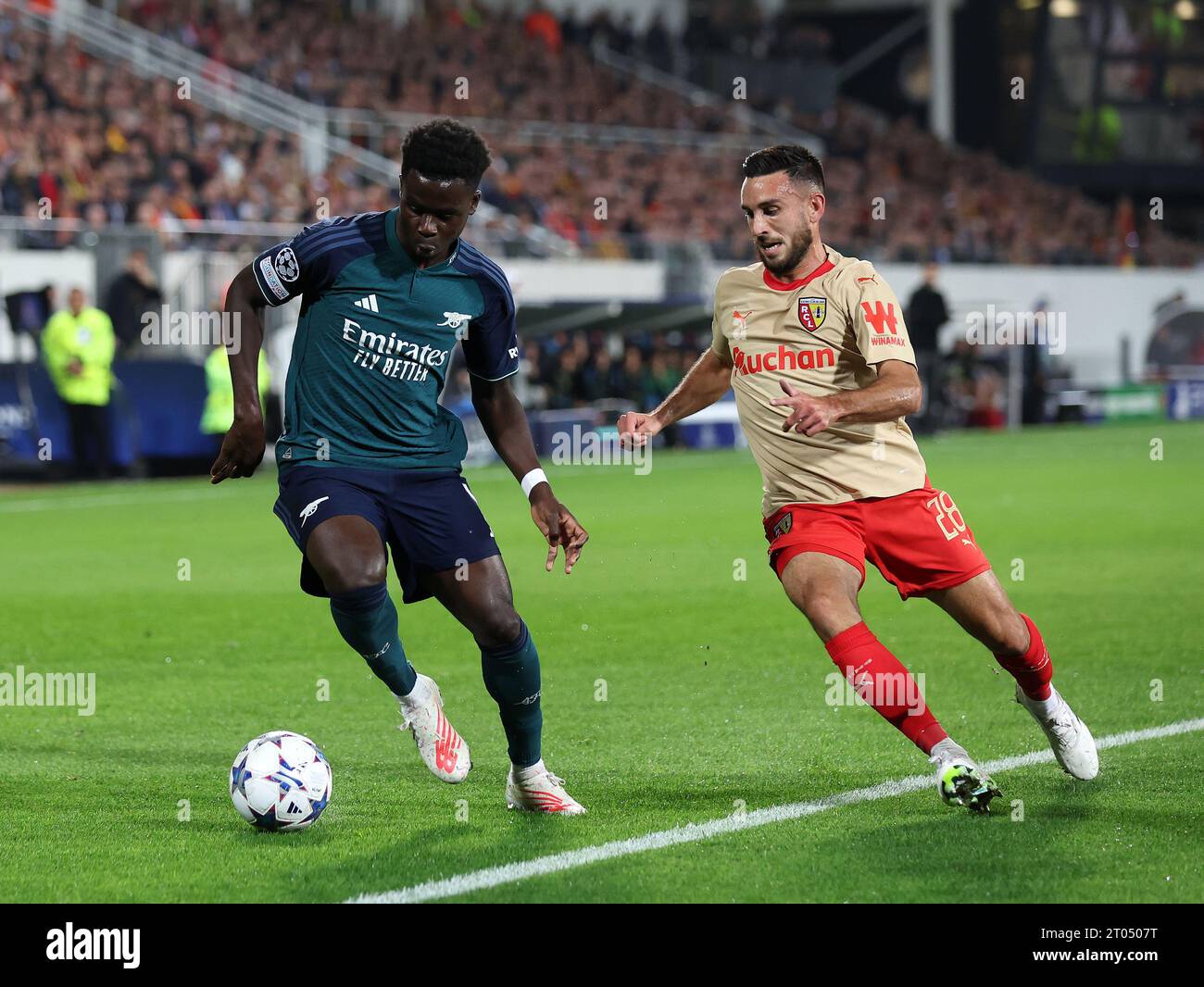 Lens, France. 3rd Oct, 2023. Bukayo Saka of Arsenal with Adrien ...