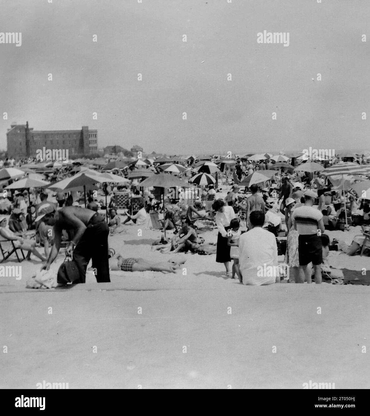 Bathers on Rockaway beach in Queens, New York. This photograph is from ...