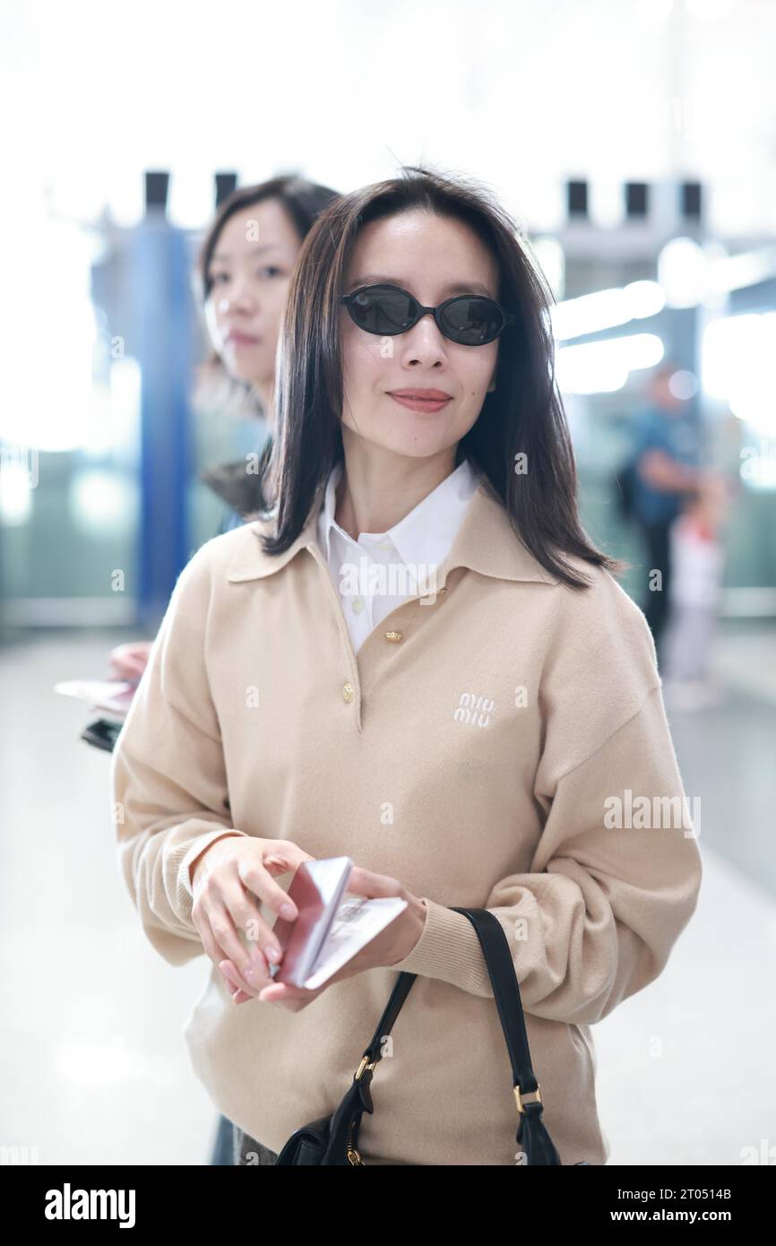 Chinese actress and dancer Dong Jie appears at the airport in Beijing ...