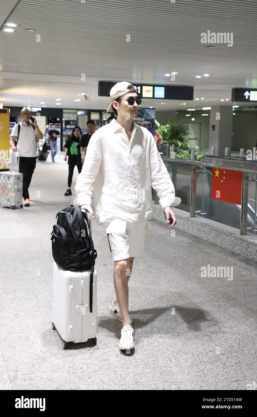 Chinese actor, singer and host Hans Zhang appears at the airport in ...