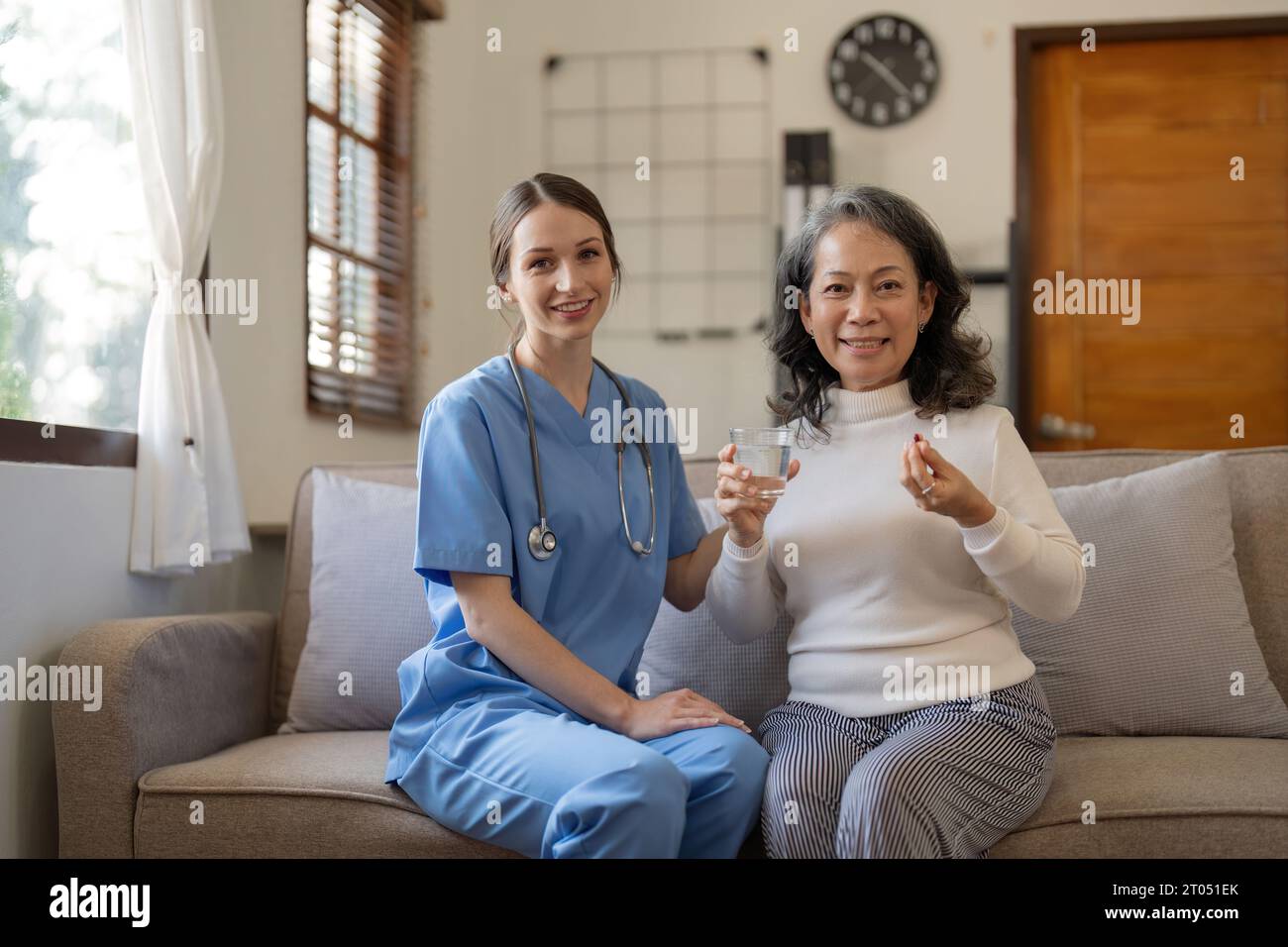 Asian senior woman patient consult with physician nurse at nursing home ...