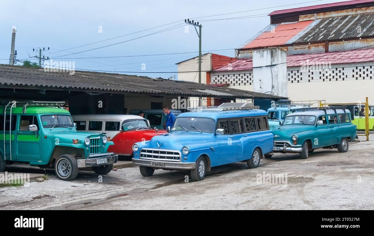 Group of old obsolete American vehicles in a passenger terminal. The ...
