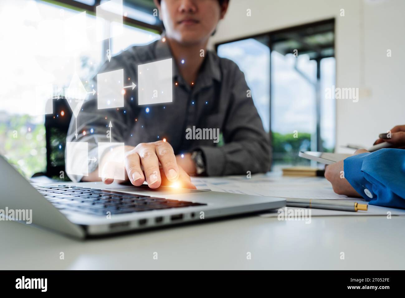 Businessman using a computer analysis for process and workflow automation with flowchart Stock ...