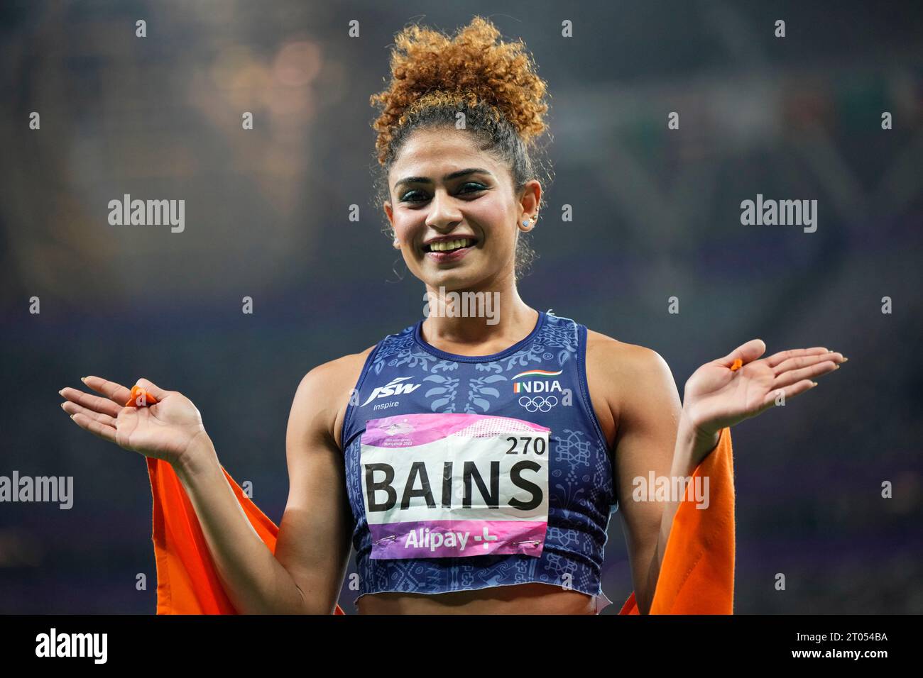 India's Harmilan Bains celebrates her second place finish to win the ...