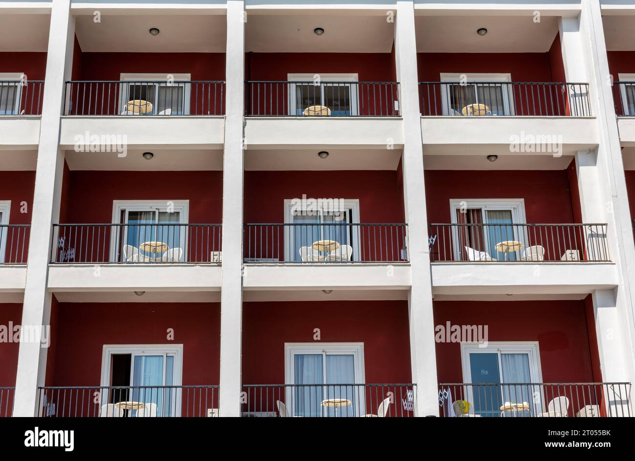 rooms at a hotel or apartrment block with balconies. small outside ...