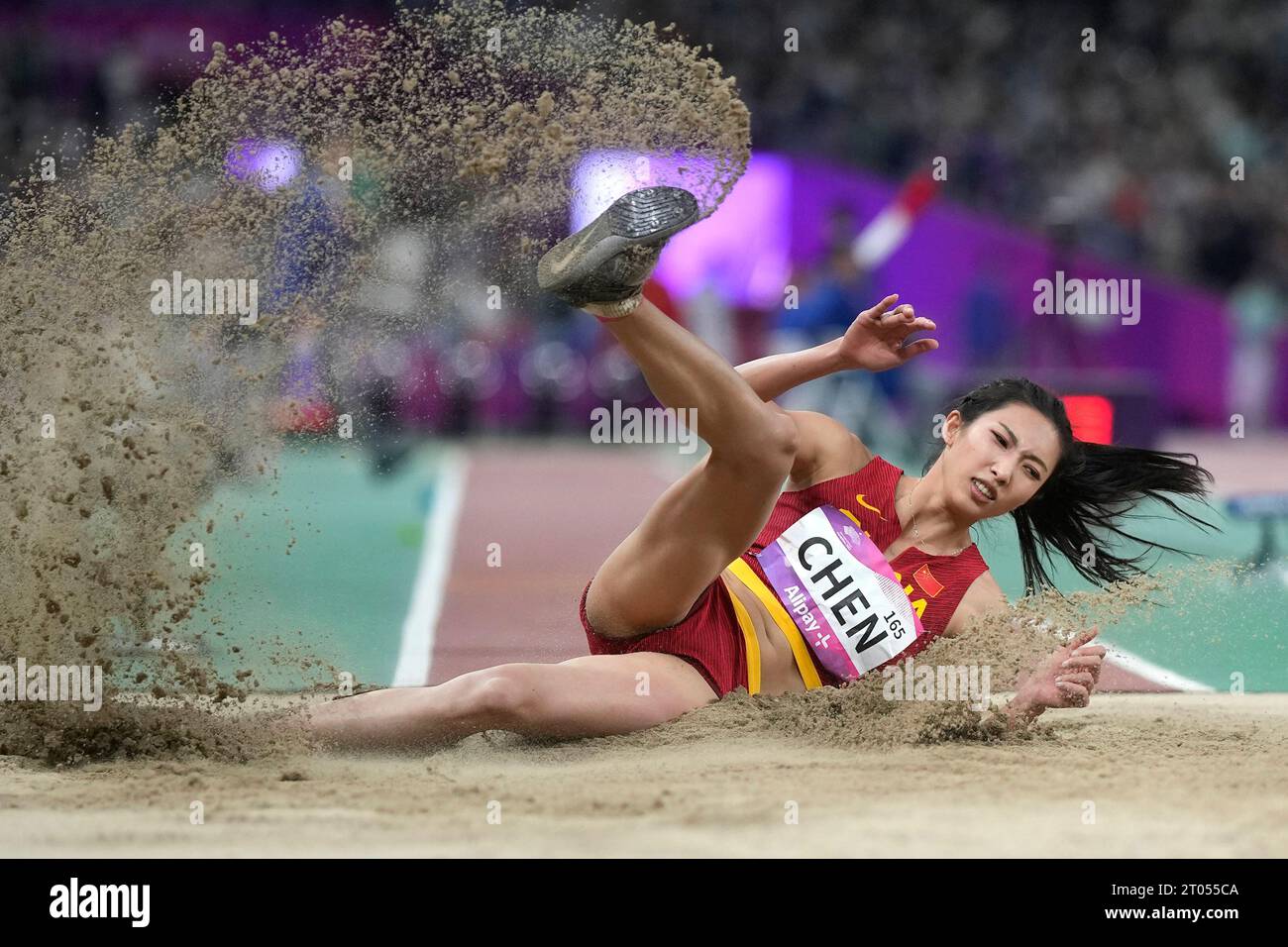China's Chen Jie competes during the women's triple jump final at the ...