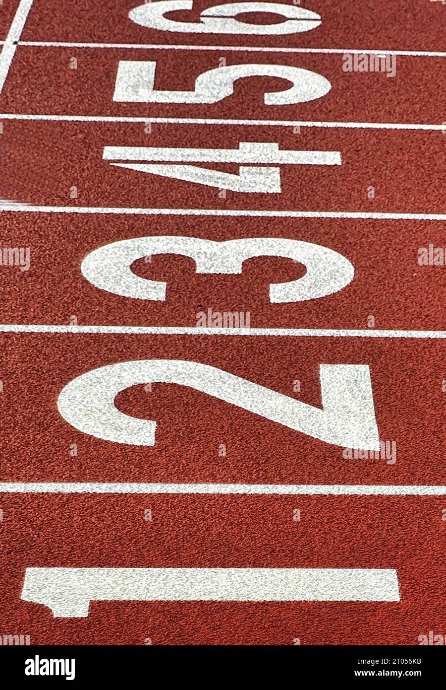 Numbers on the surface of a running track Stock Photo - Alamy