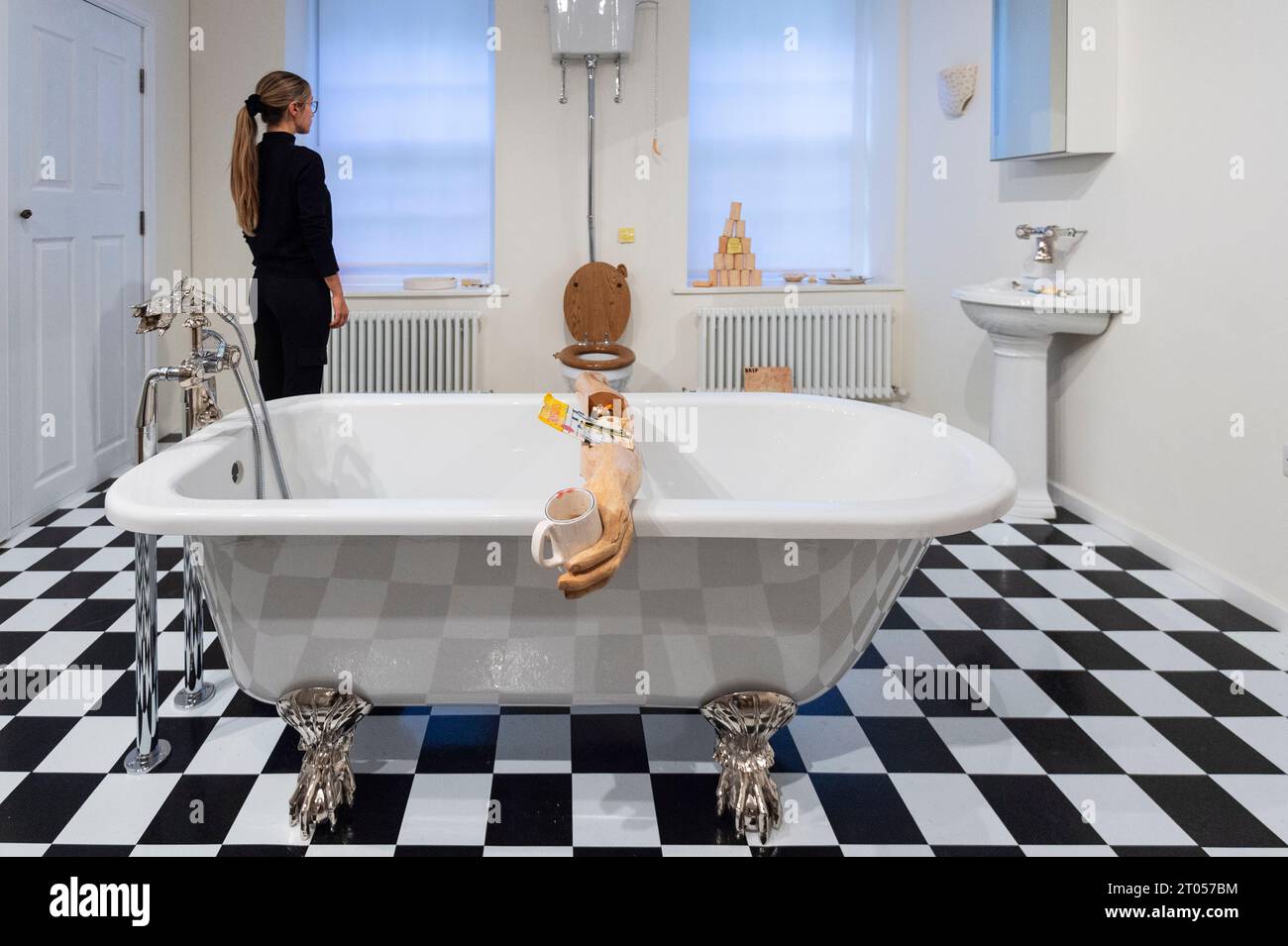 London, UK. 4 October 2023. A staff member poses at a preview of Echo ...