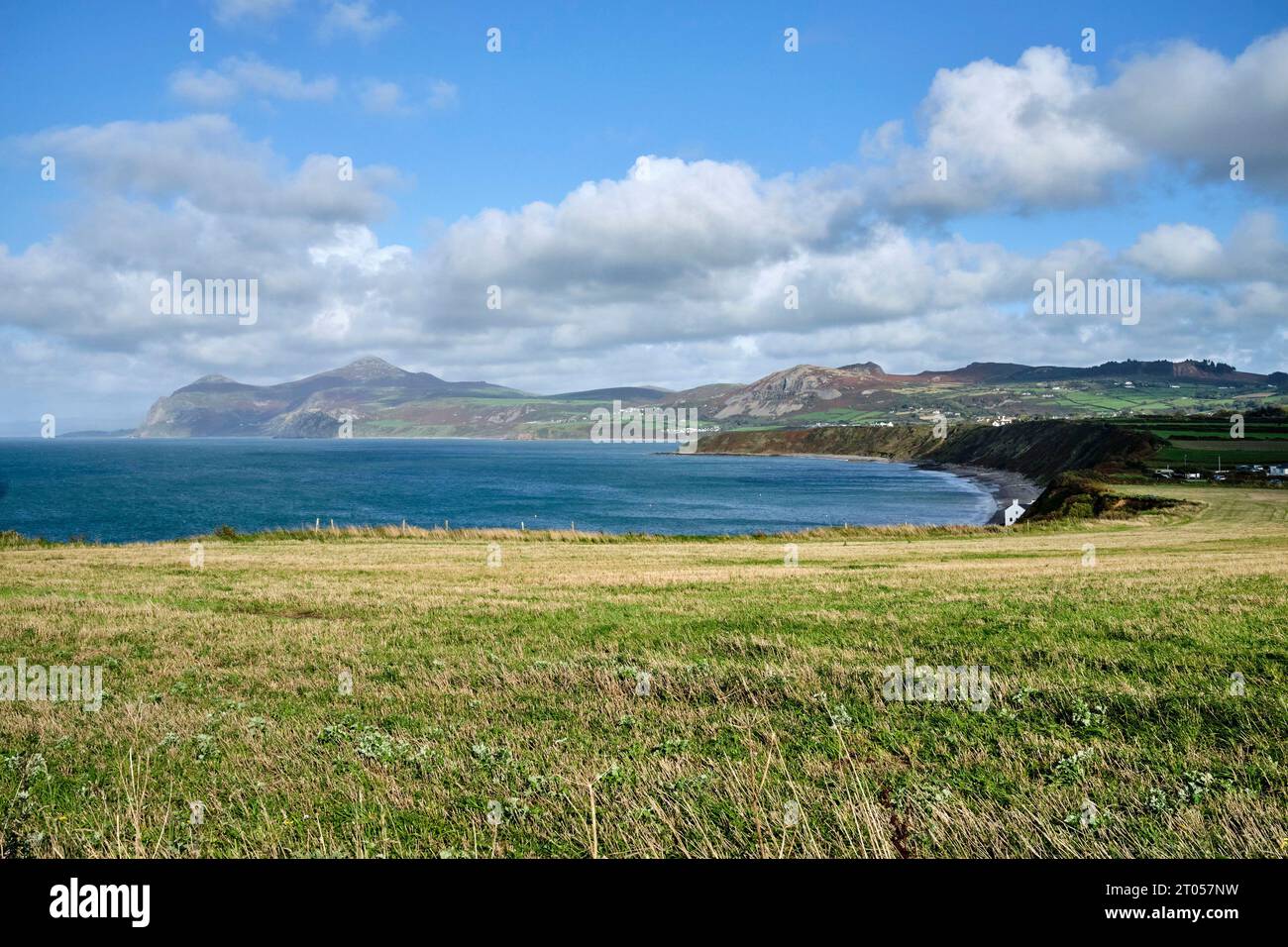 The sea, beach and mountains at the coastal community of Morfa Nefyn ...
