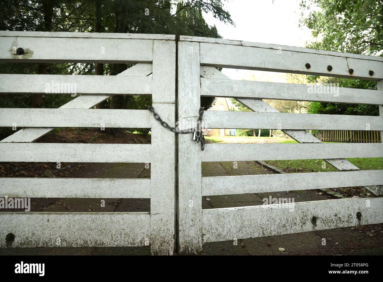 A padlock on the gates of a house on Heath Road, Whitmore Heath in the ...