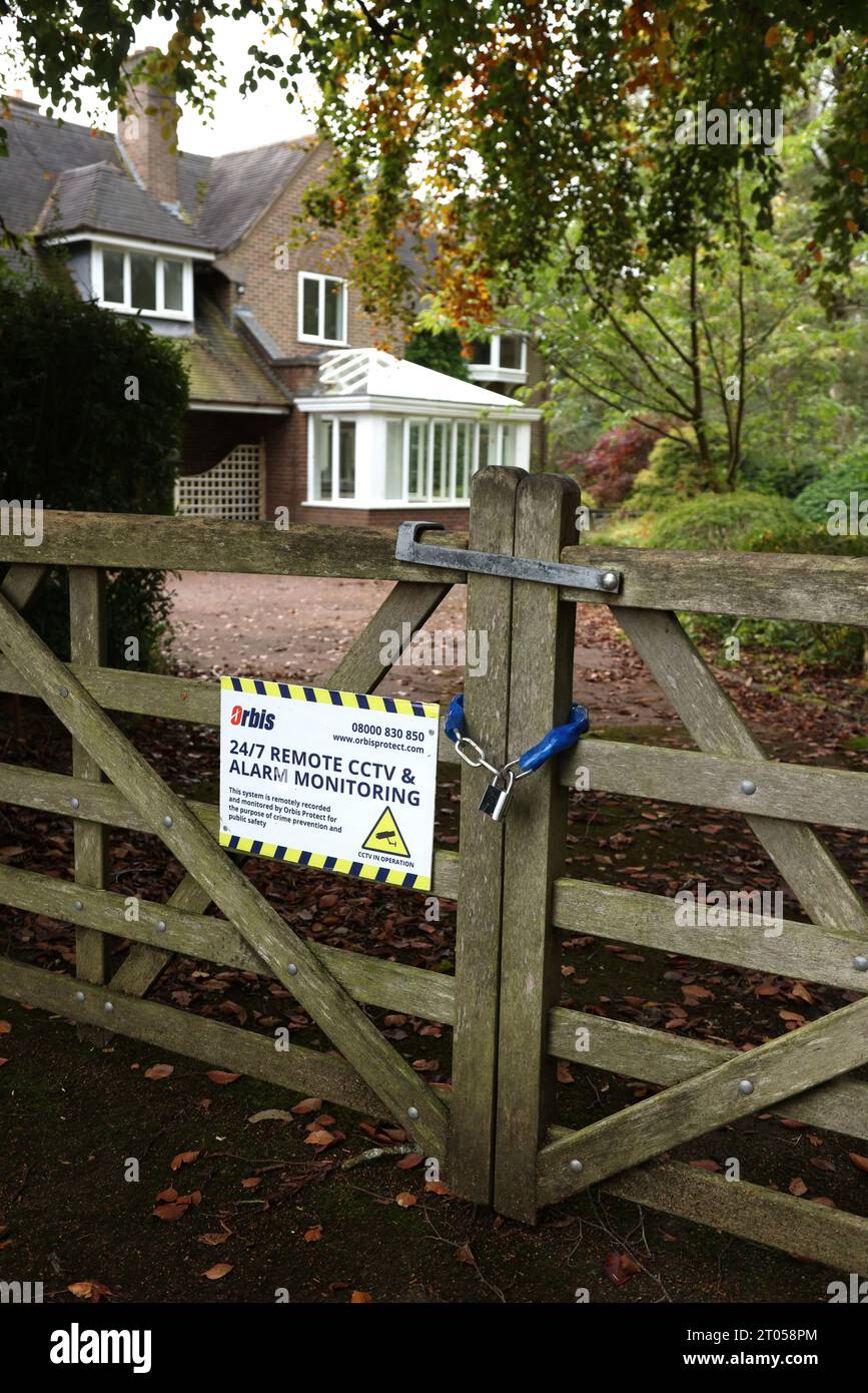 A padlock on the gates of a house on Heath Road, Whitmore Heath in the ...